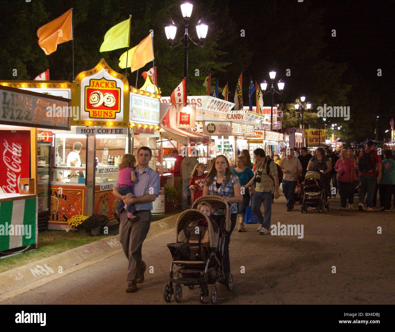 Crowds of people enjoy an evening at the North Carolina State Fair ...