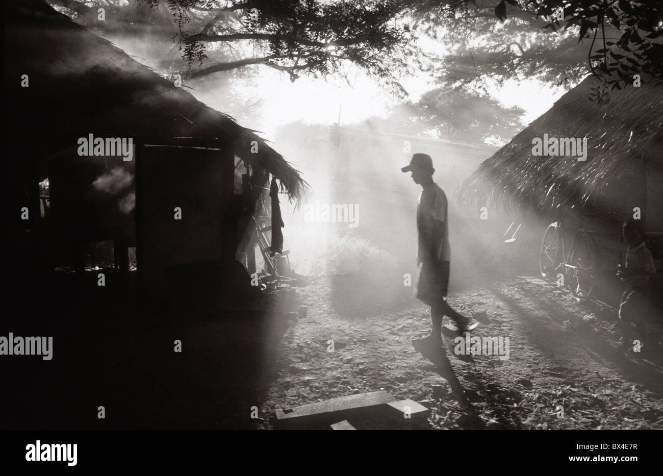 straw huts huts man sun rays rays of sunshine settlement person life ...