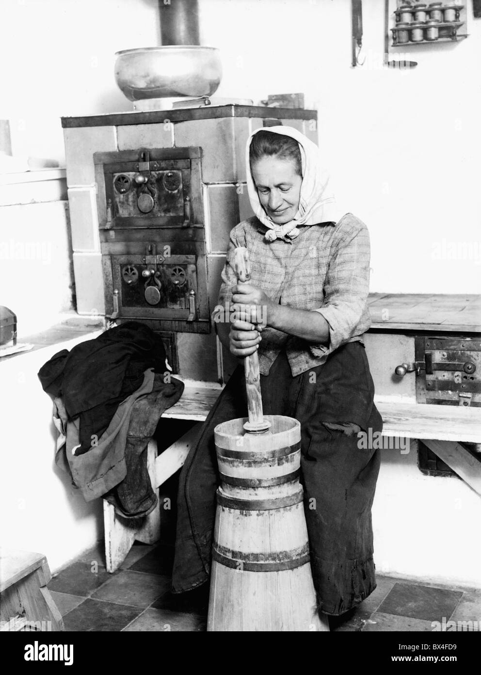 Butter making, Czech woman with wooden tool to make butter, butter ...