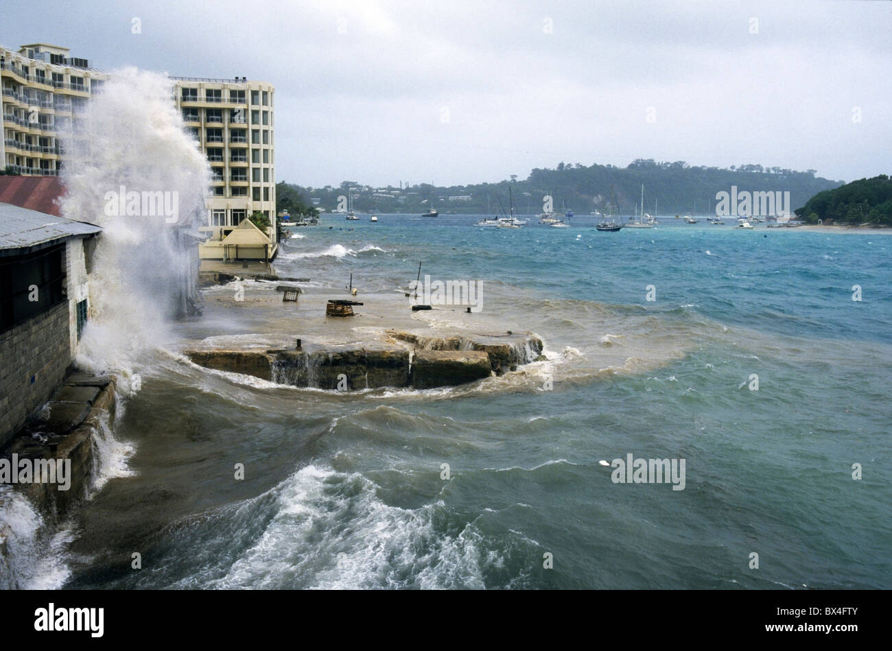 Violent waves crash against buildings in Port Vila Bay during Cyclone ...