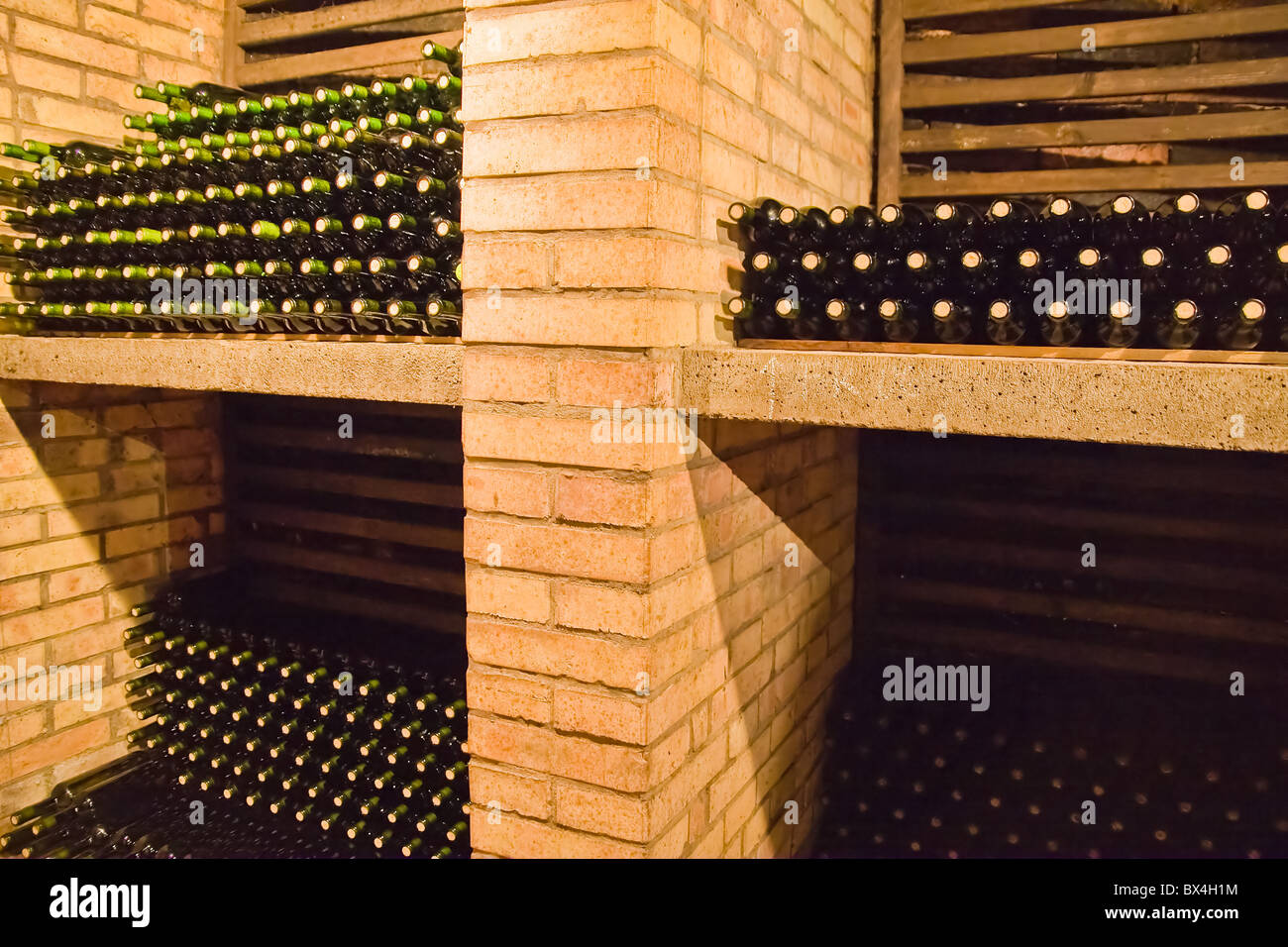 stacked up wine bottles in the cellar Stock Photo - Alamy