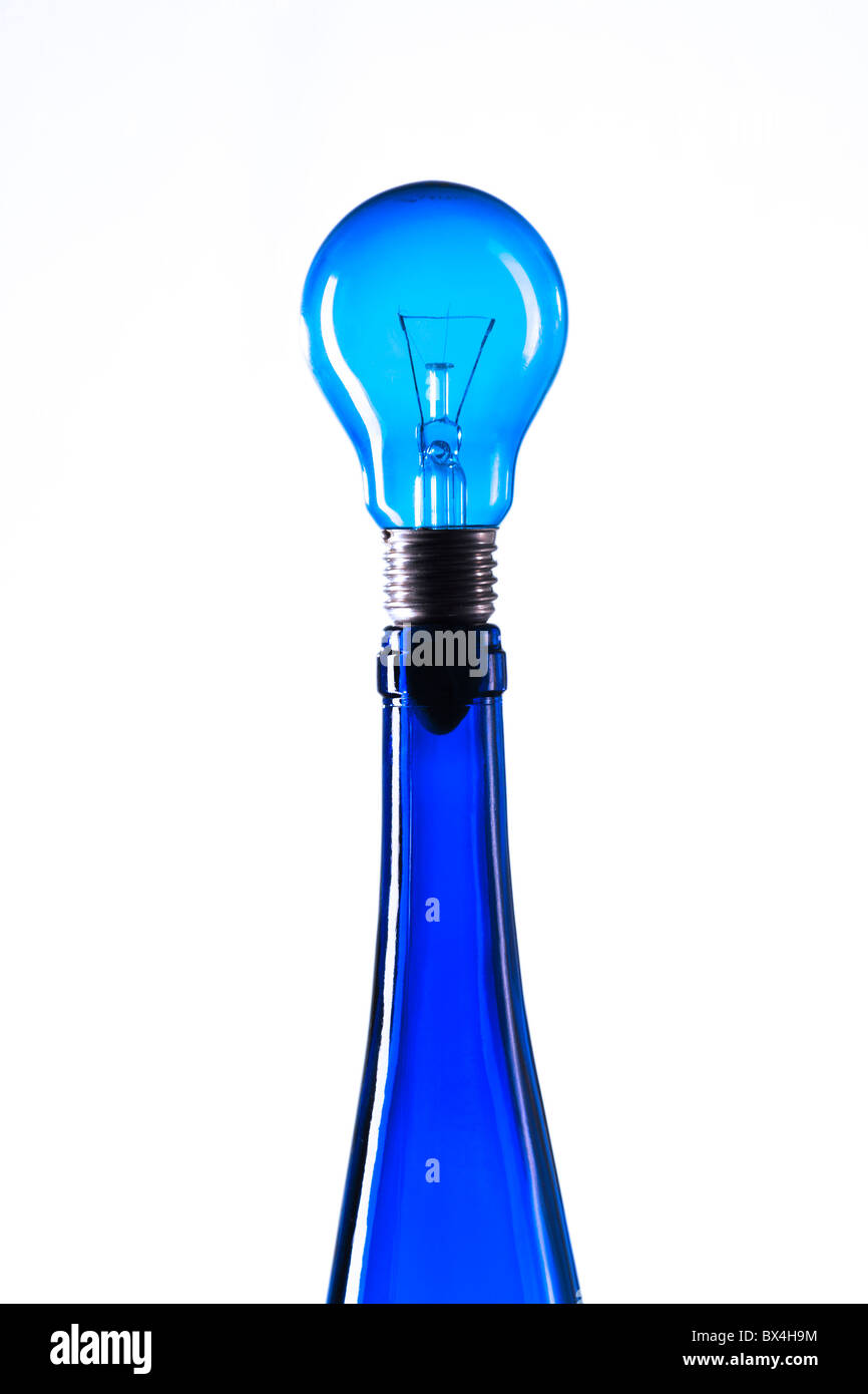 Blue daylight bulb in top of a blue wine bottle on a white background ...