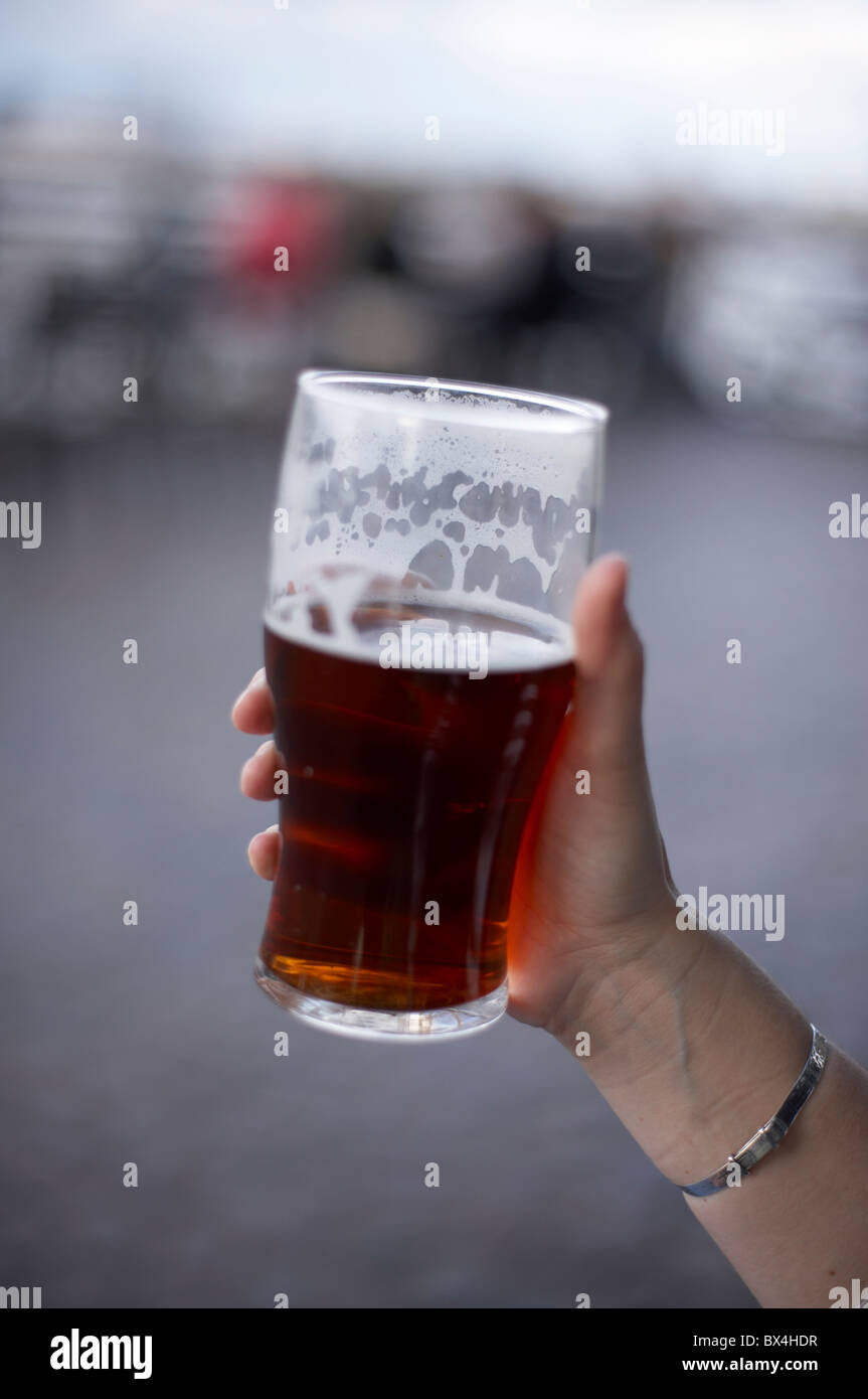 hand holding pint Stock Photo - Alamy
