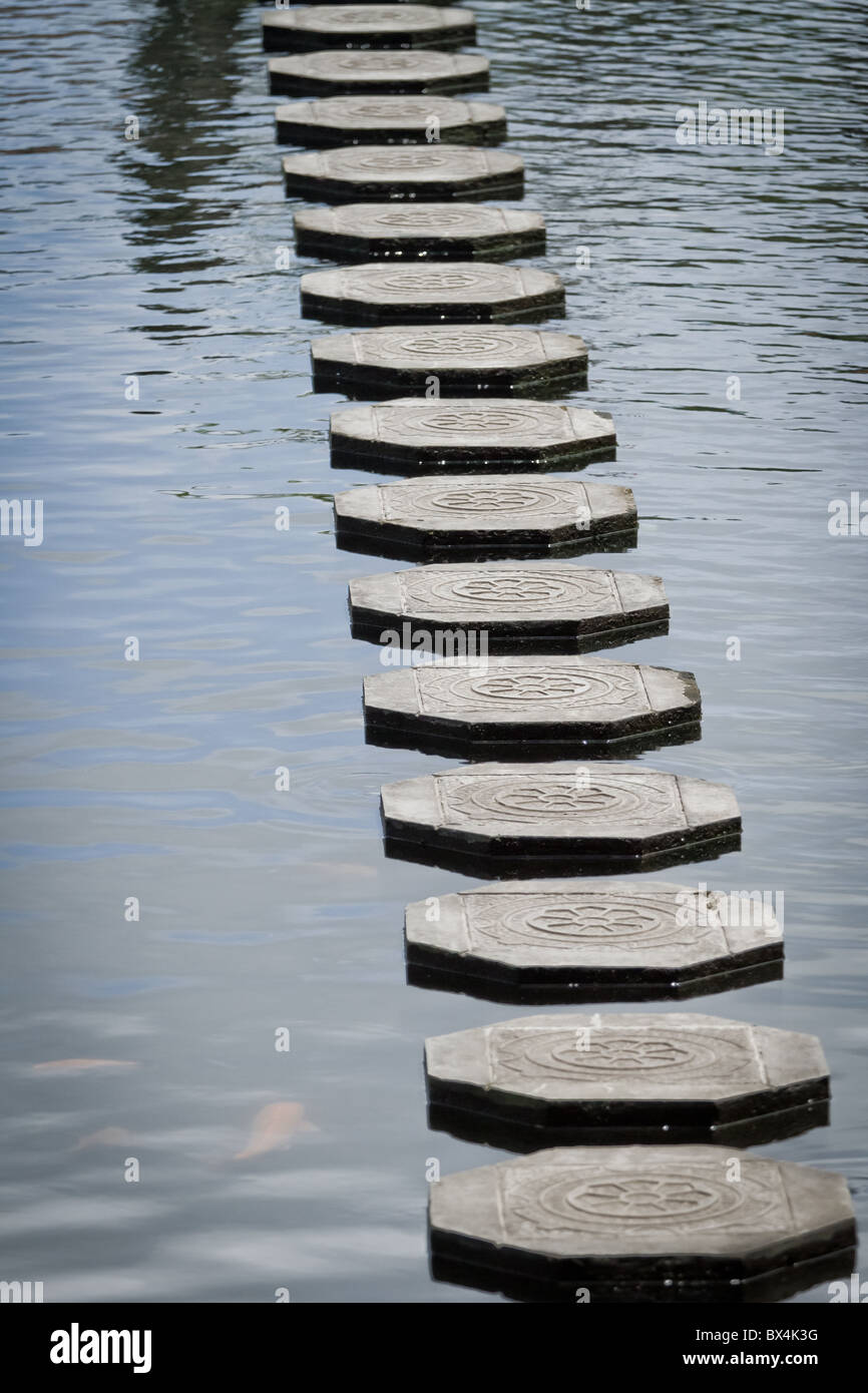 stone steps floating on the water, Tirtagangga water palace, Bali ...