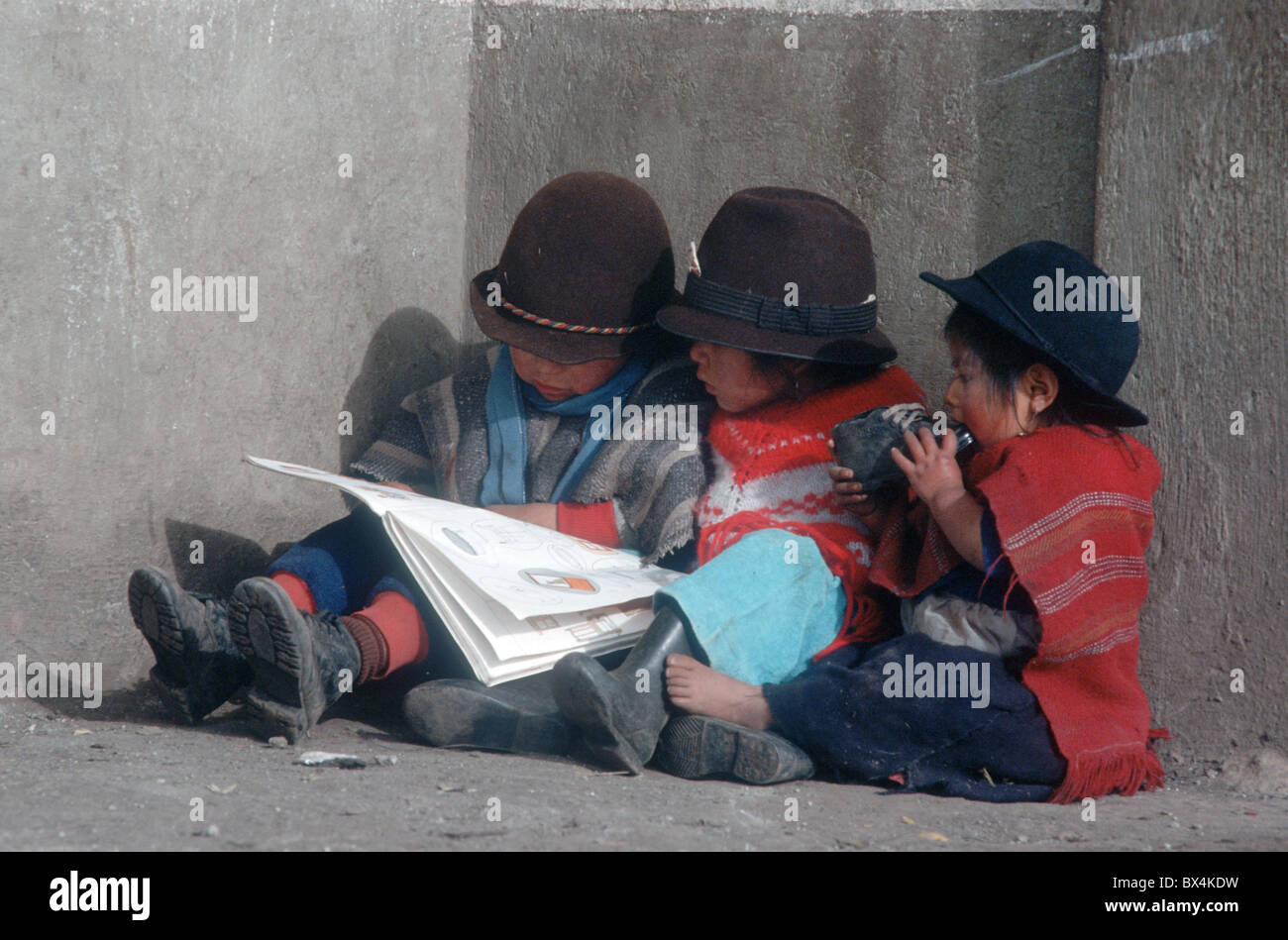 ECUADOR. NATIVE QUECHUA CHILDREN READING AT A SCHOOL IN A VILLAGE IN ...