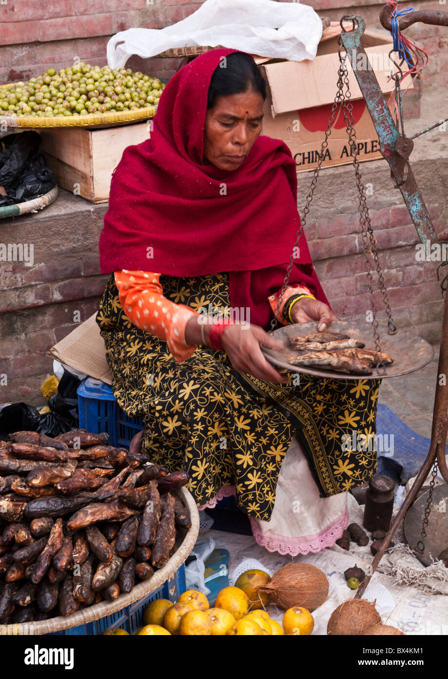 Lady weighing produce, Durbar Square, Kathmandu, Nepal Stock Photo - Alamy