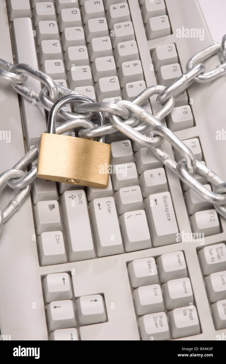Metal chain securing computer keyboard Stock Photo - Alamy
