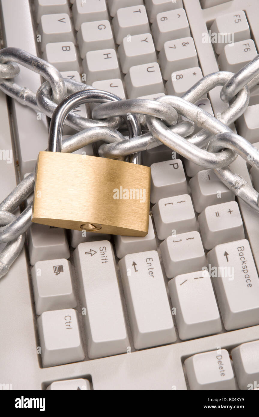 Metal chain securing computer keyboard Stock Photo - Alamy