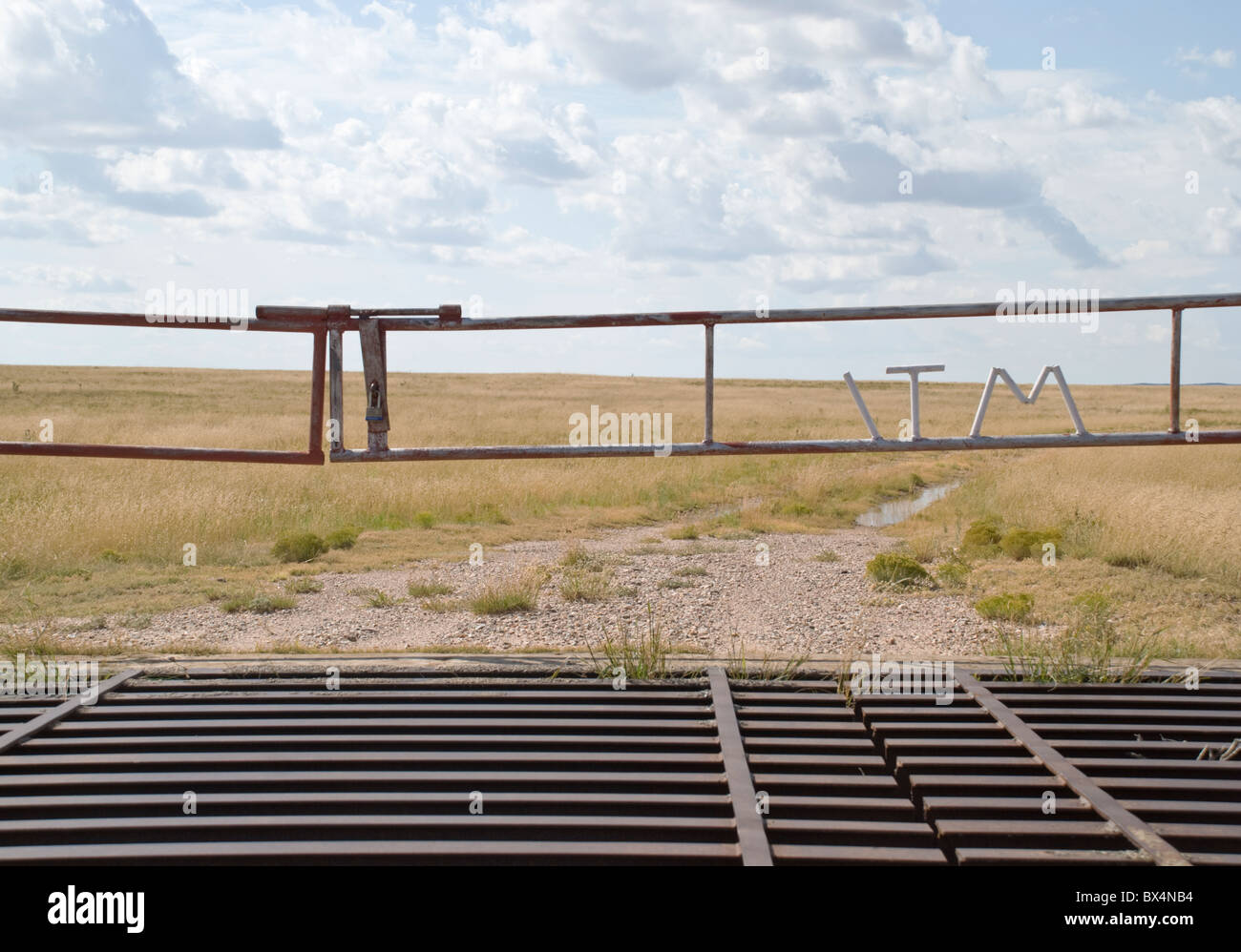 A ranch gate and cattle guard in a remote area of New Mexico Stock ...