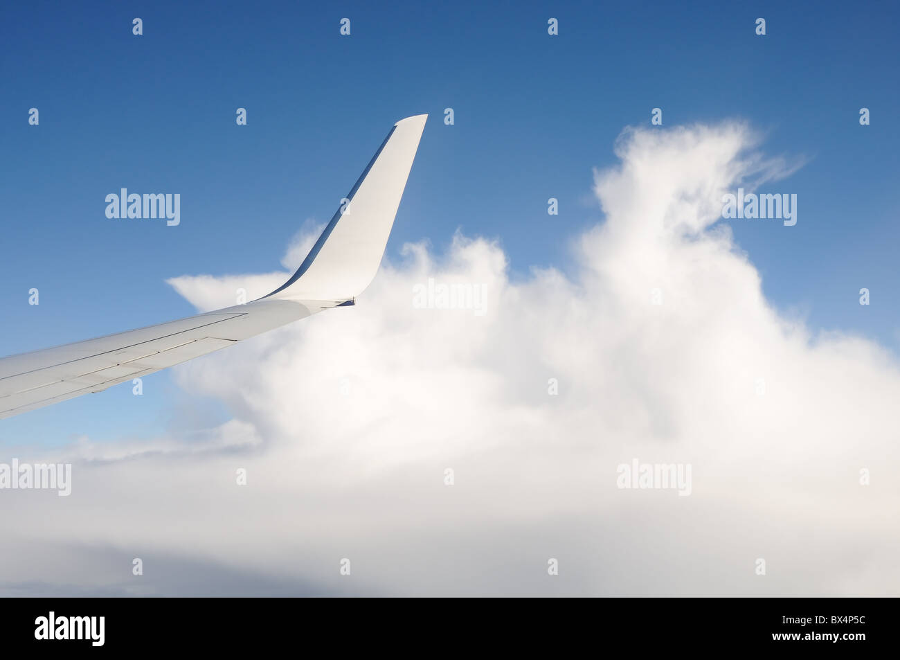 View of plane window with clouds Stock Photo - Alamy