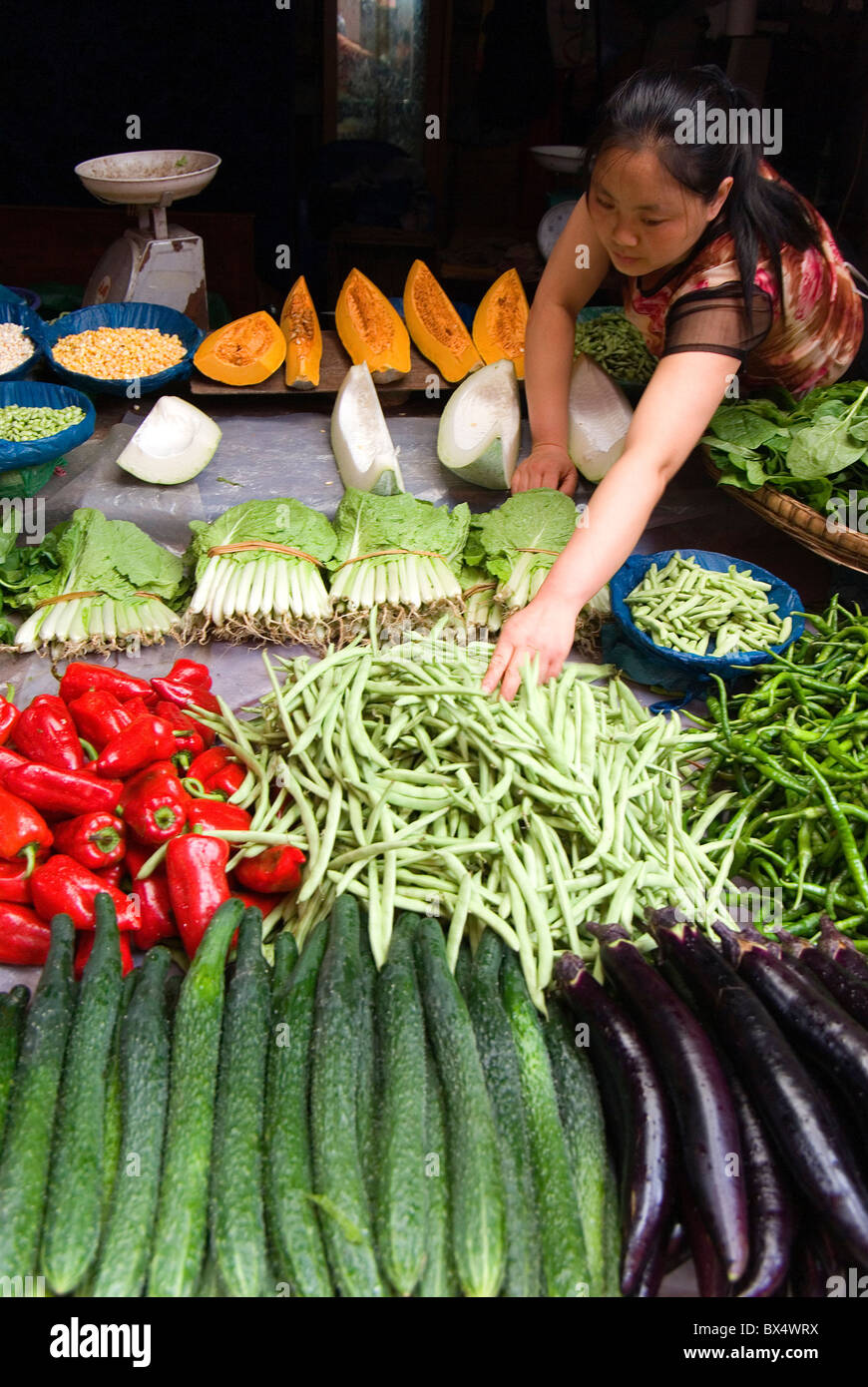 Chengdu - woman selling vegetables on local market Stock Photo - Alamy