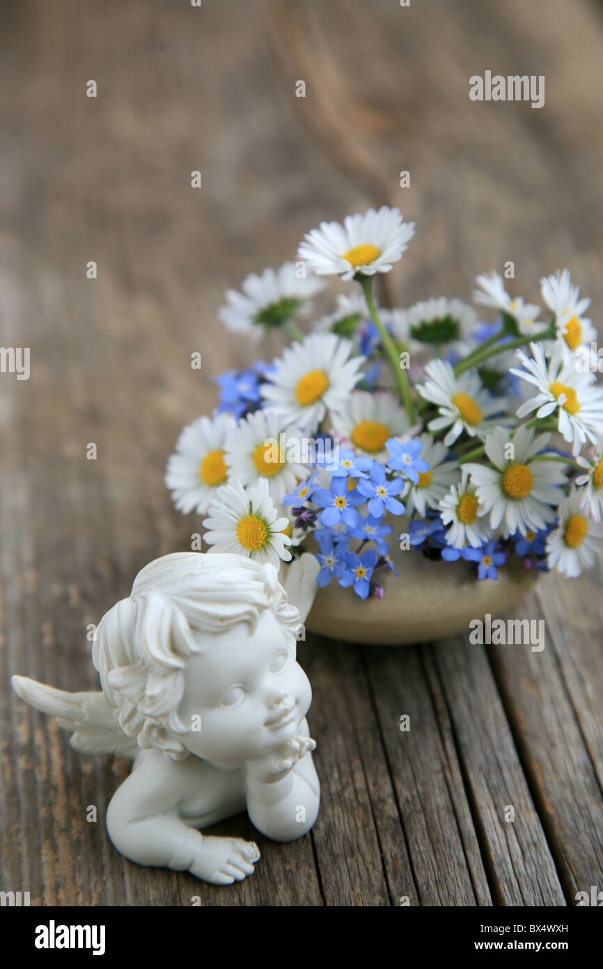 Angel and flower arrangement Stock Photo - Alamy