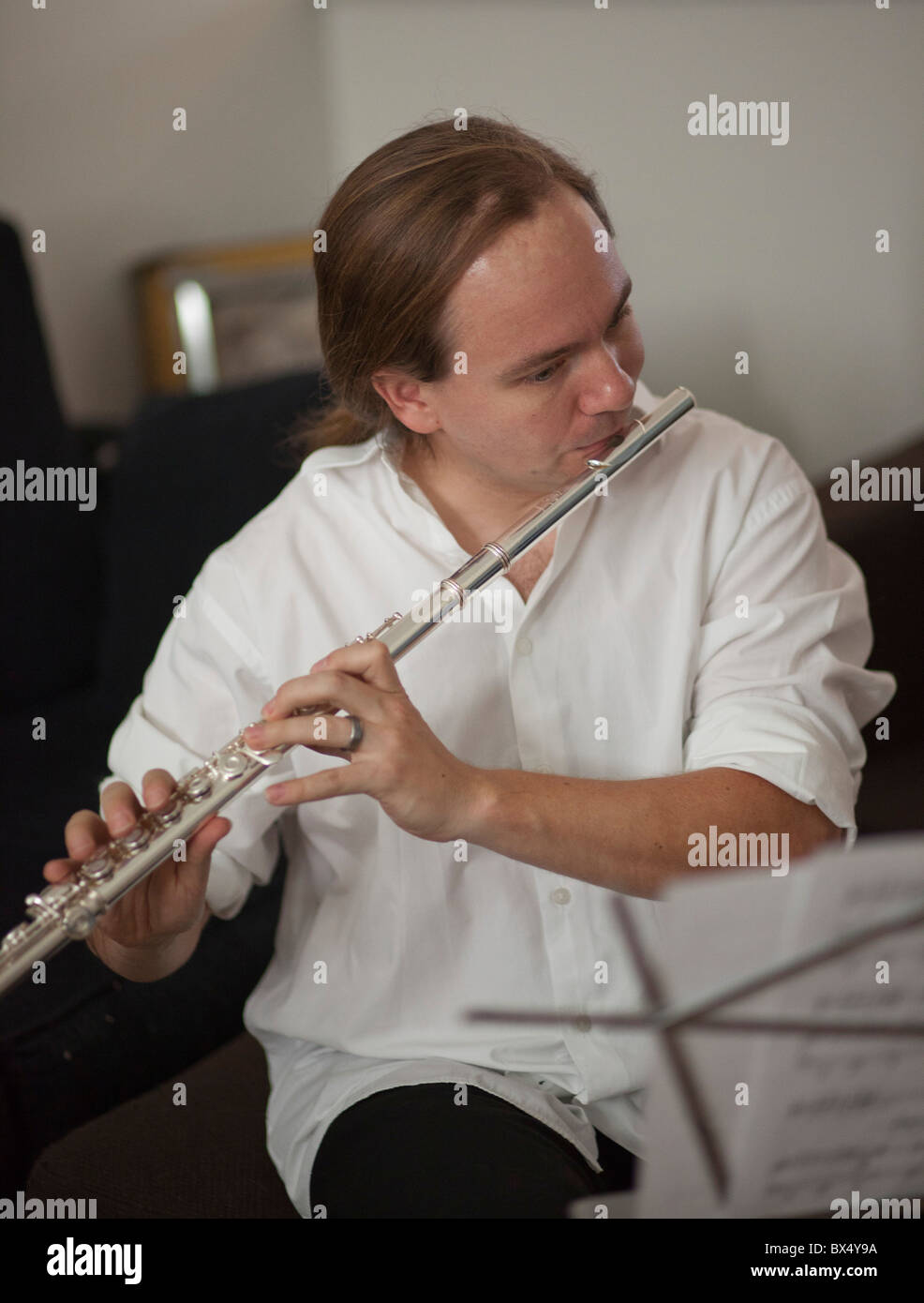 A man playing the flute Stock Photo - Alamy