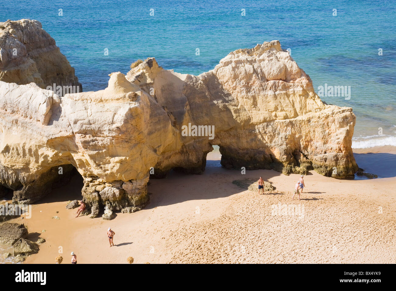 A sandy beach with interesting rocks at "Praia dos Tres Castelos" in ...