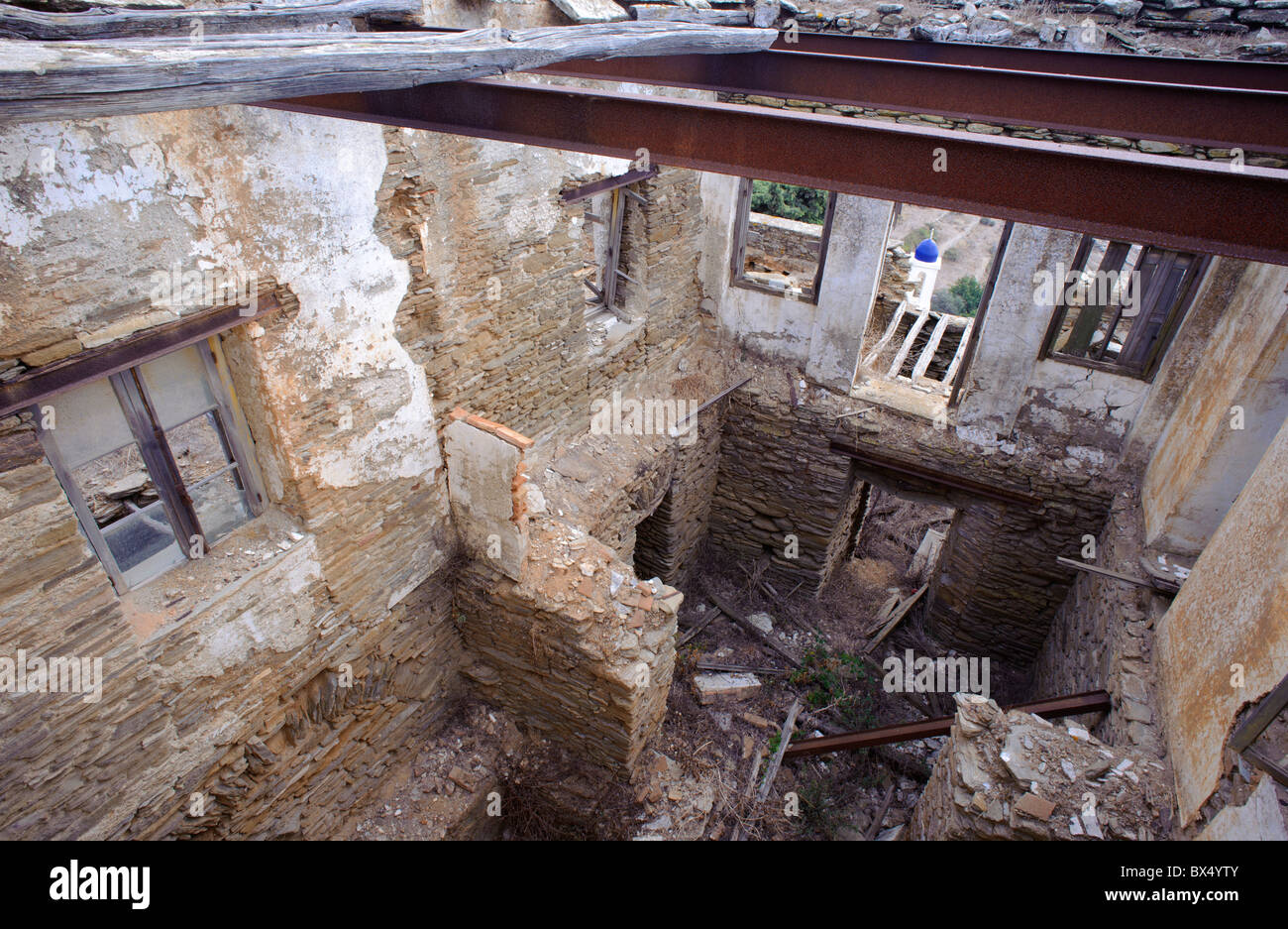 Interior of an abandoned dilapidated house on the Greek Cyclade island ...