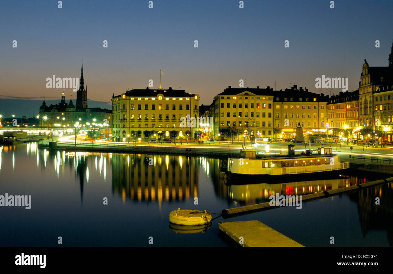 Stockholm - water, elegant buildings and spire seen at night. the ...