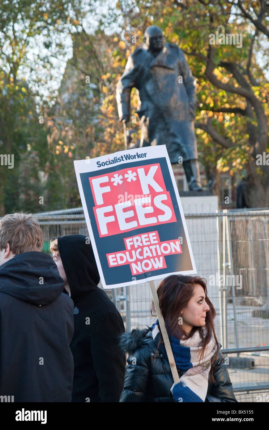 A female student holding placard against university fee rise in ...