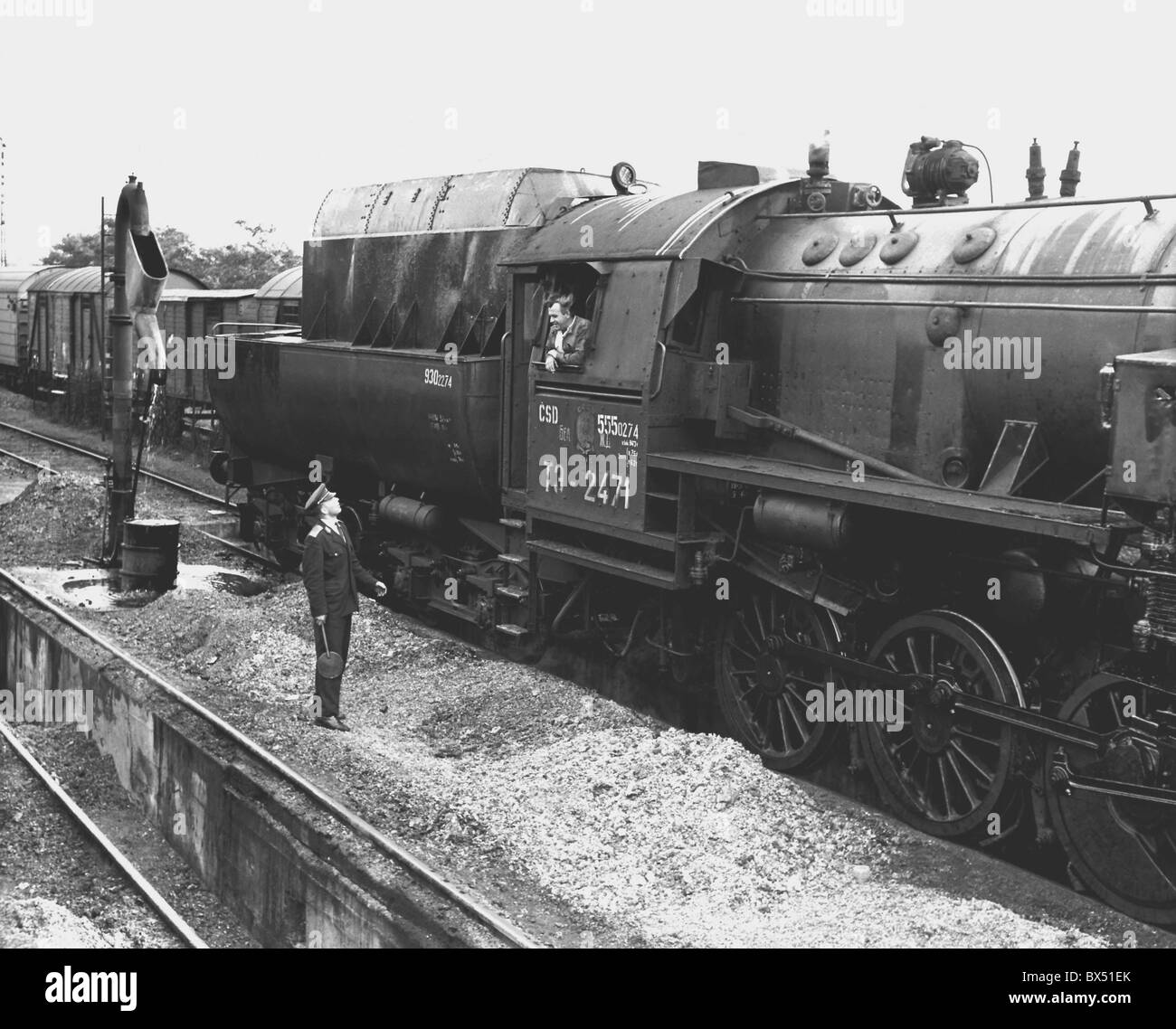 Steam locomotive with engineer speaking with train dispatcher in ...