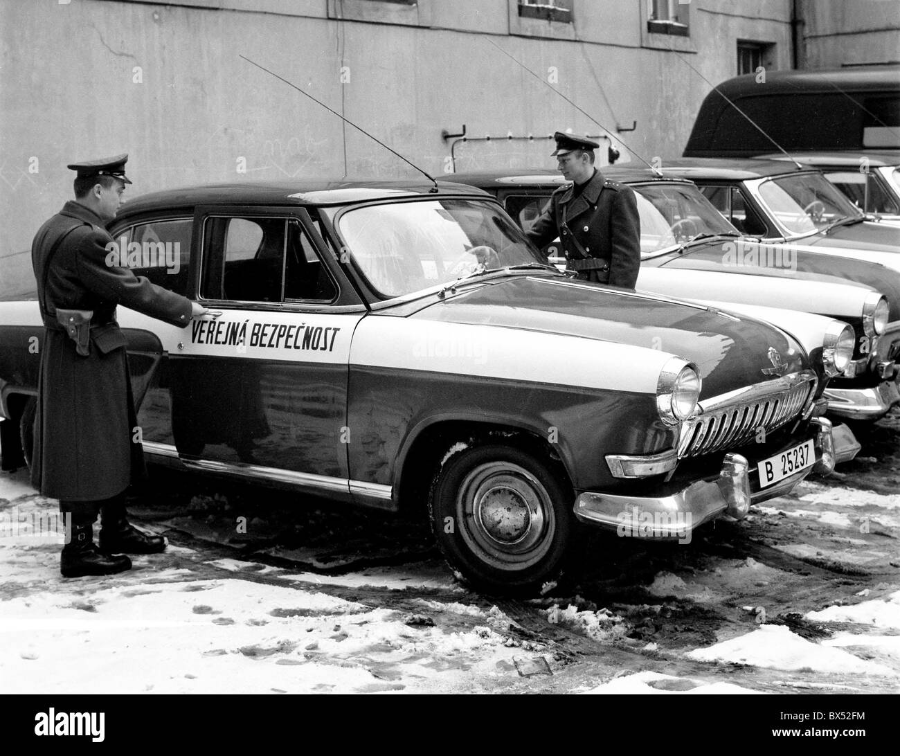 Patrolmen public security officers snb entering their police cruiser hi ...