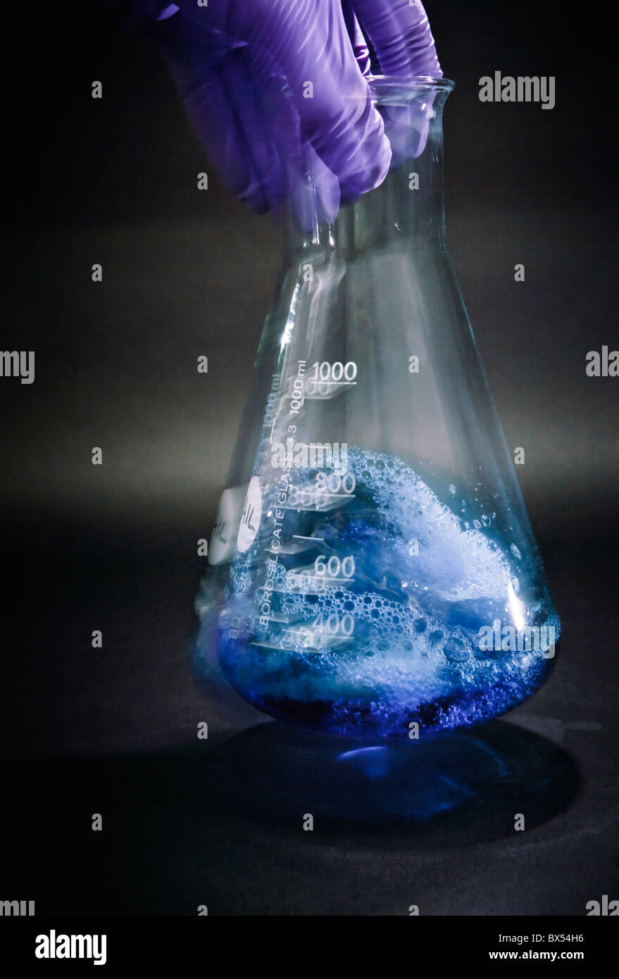 Glove hand liquid shaking hi-res stock photography and images - Alamy