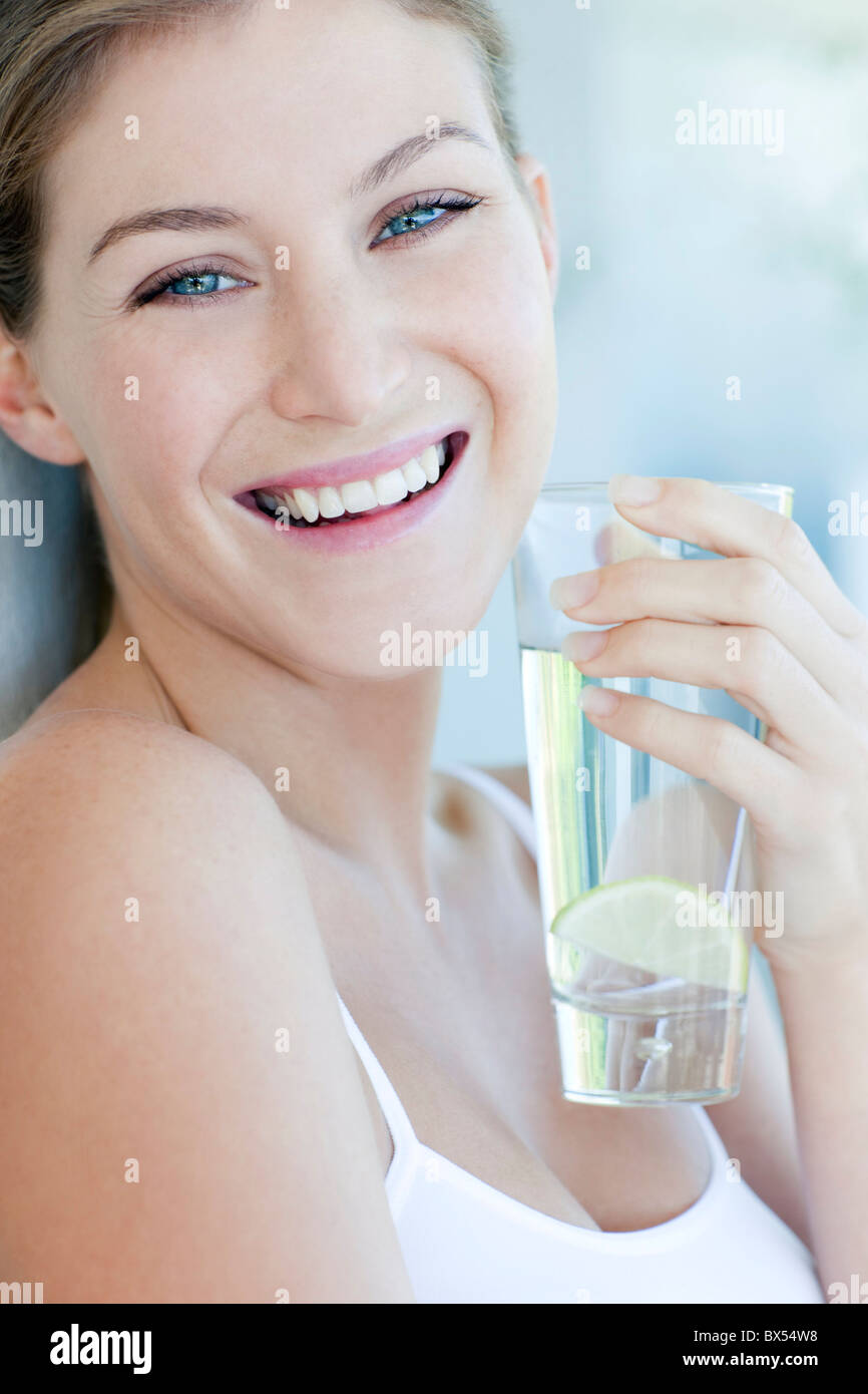 Woman drinking water eye contact happy hi-res stock photography and ...