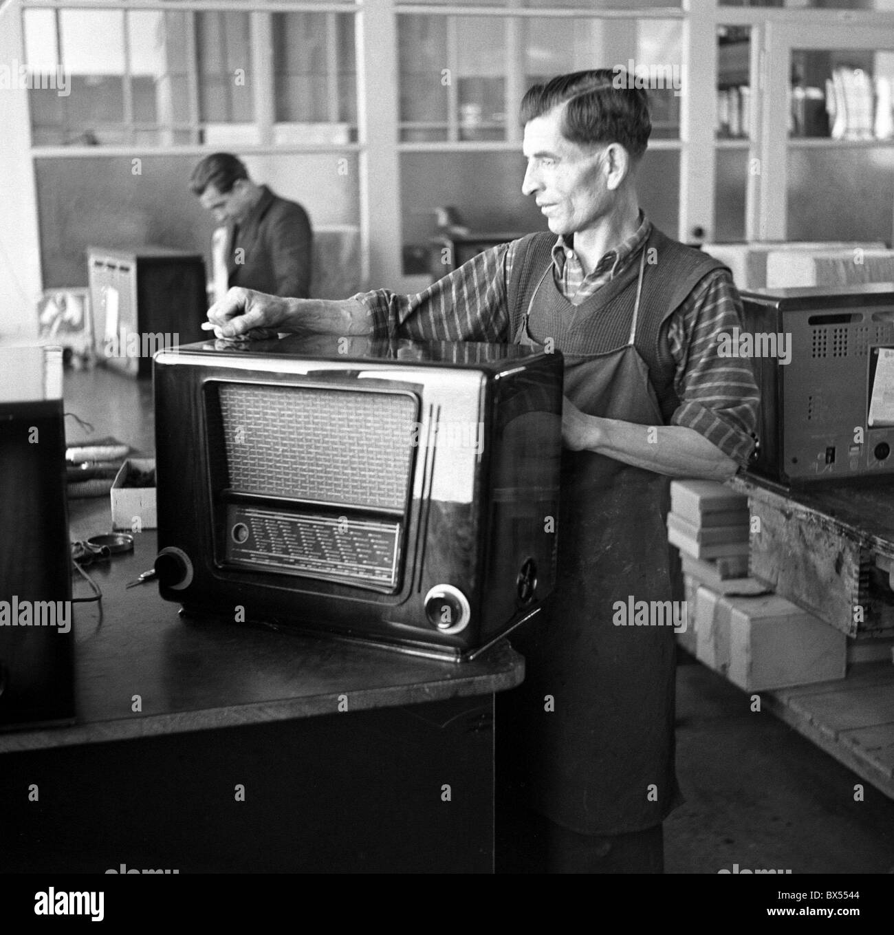 Prague 1947. Tesla factory. Worker assembles radios. CTK Vintage Photo ...