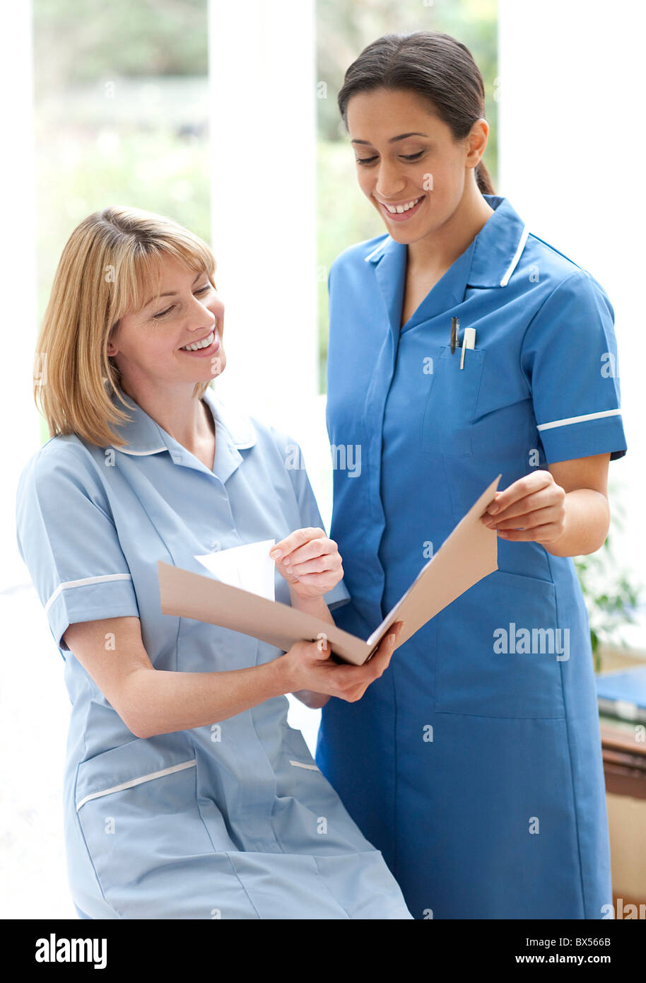 Nurses checking notes Stock Photo - Alamy