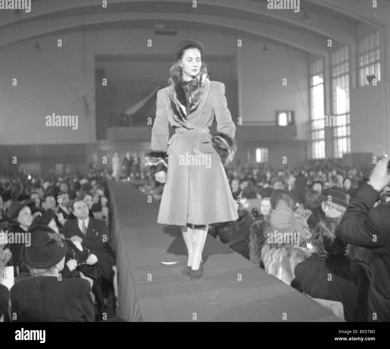 Spectators walk Black and White Stock Photos & Images - Alamy