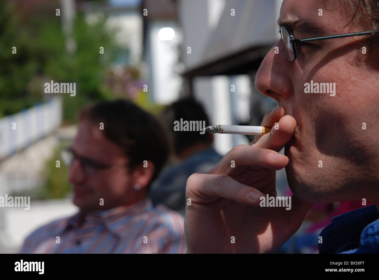 Man smoke a Cigarette Stock Photo - Alamy