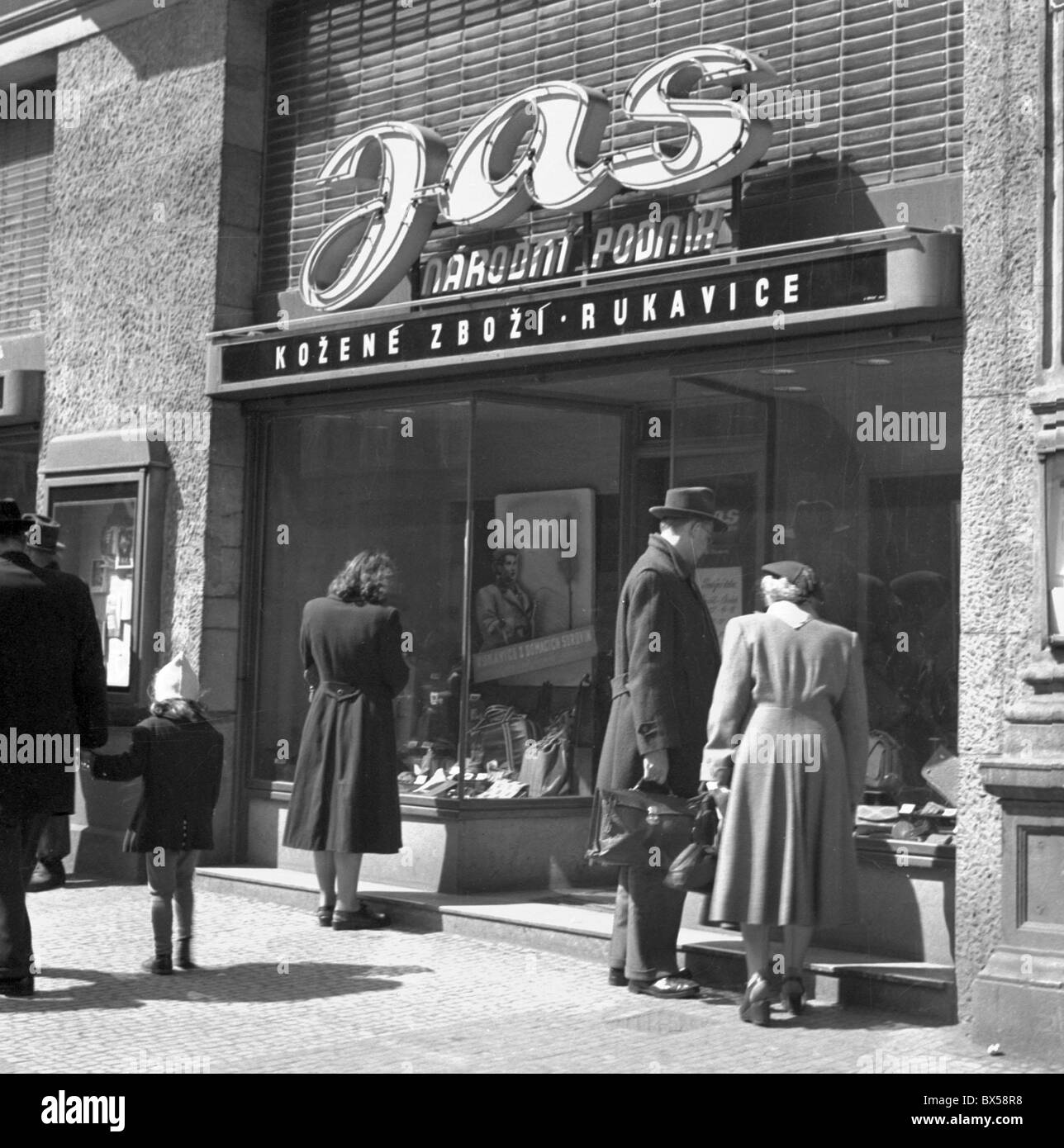 Czechoslovakia - Prague, 1951. Pedestrians check out window display of ...