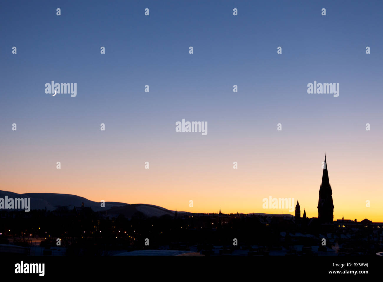 Winter sunset afterglow with church steeple silhouette, Edinburgh ...
