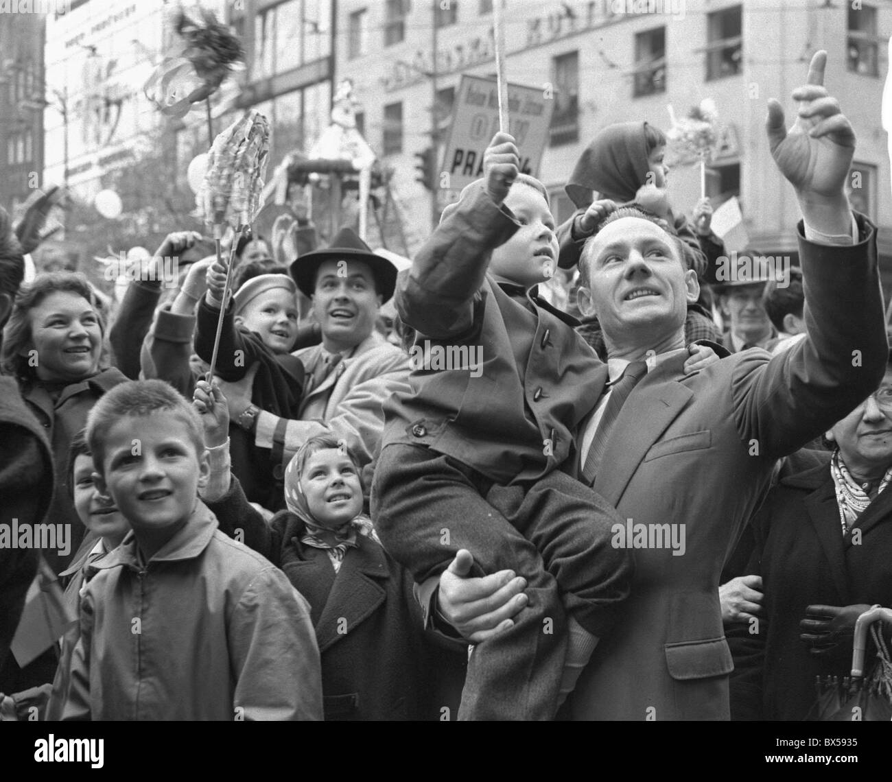 Enthousiastic crowd wave at Communist dignitaries during May Day ...
