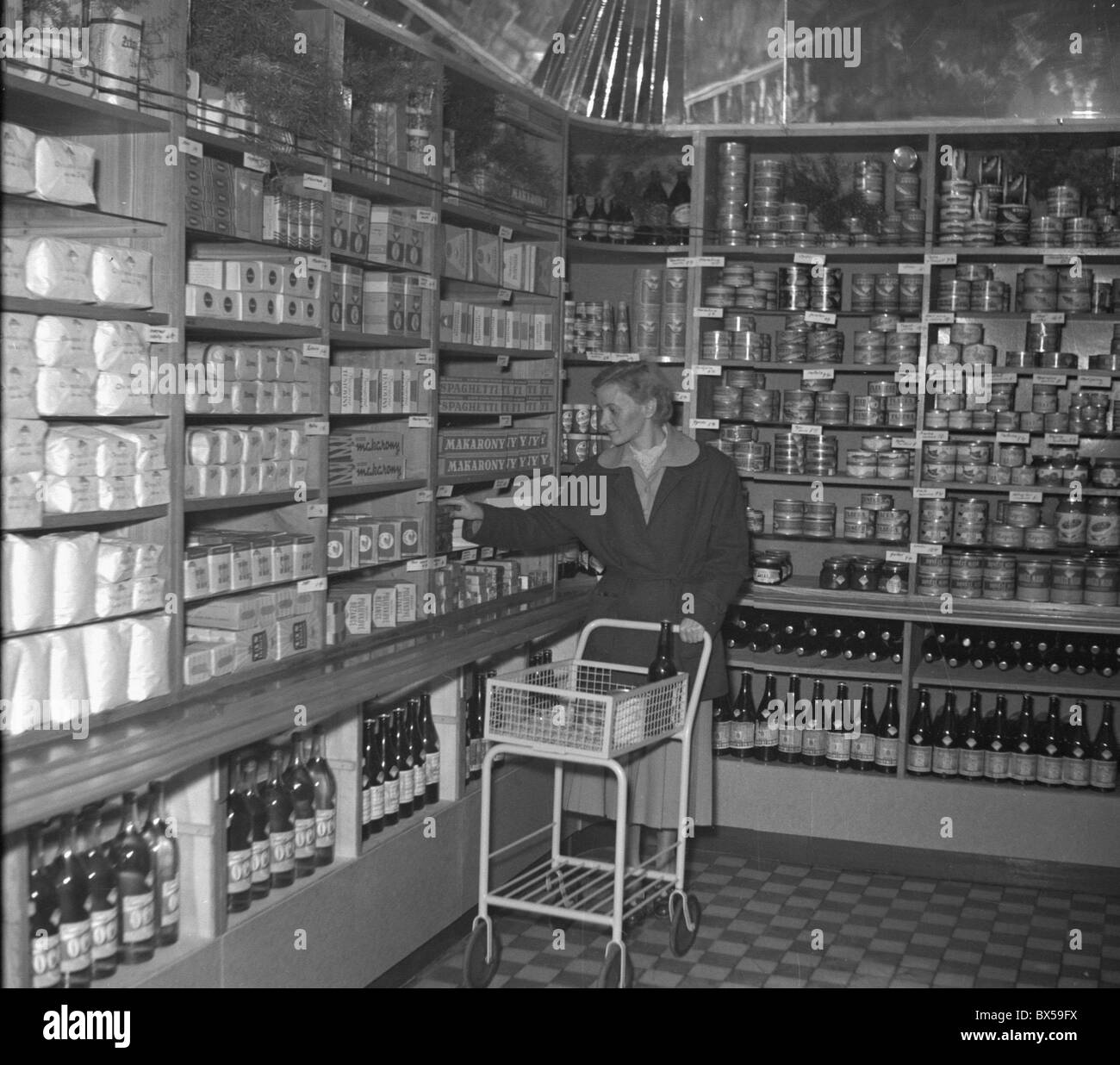 Czechoslovakia 1955. Woman picks up goods in the first small self ...