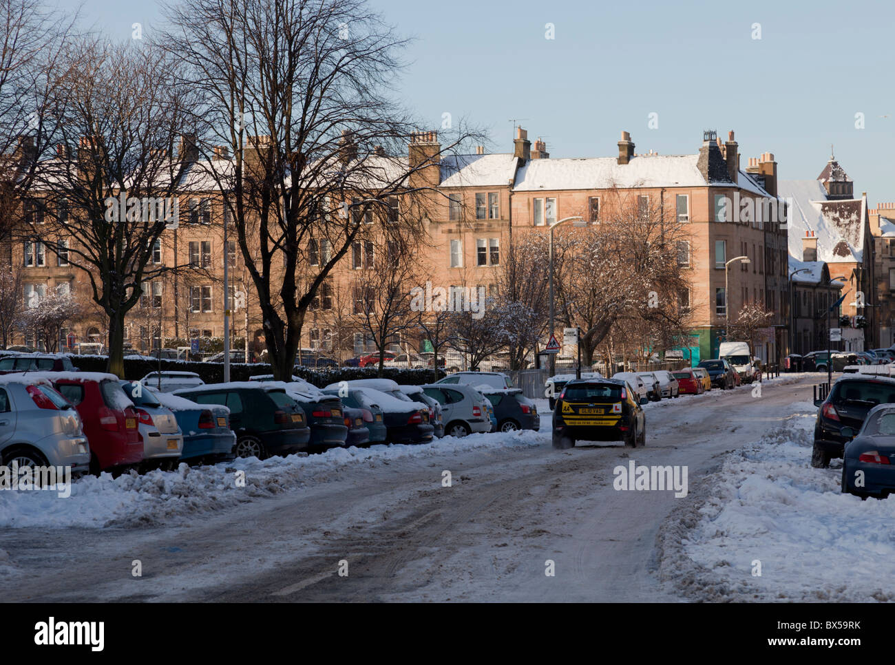 A learner driver on a snowy icy street, Dalmeny St Edinburgh Scotland ...
