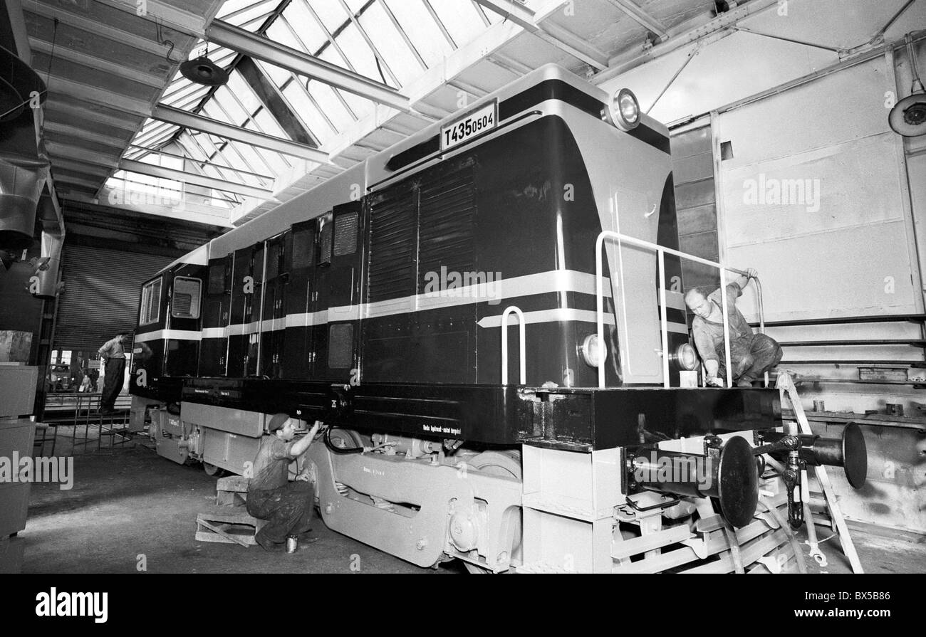 Worker attends newly produced diesel locomotive at plant in Prague ...
