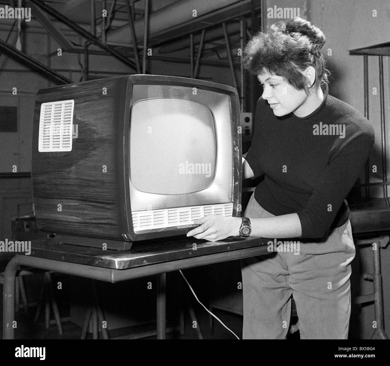 Female worker employed by Tesla factory presenst new tv set Amatyst in ...