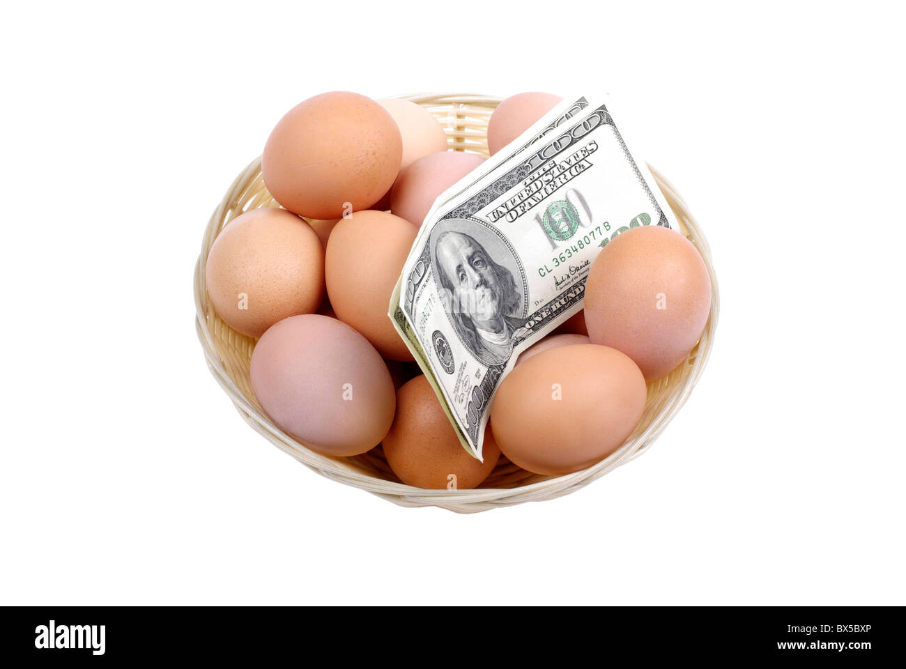 Eggs with dollars in basket isolated on white background. Financial ...