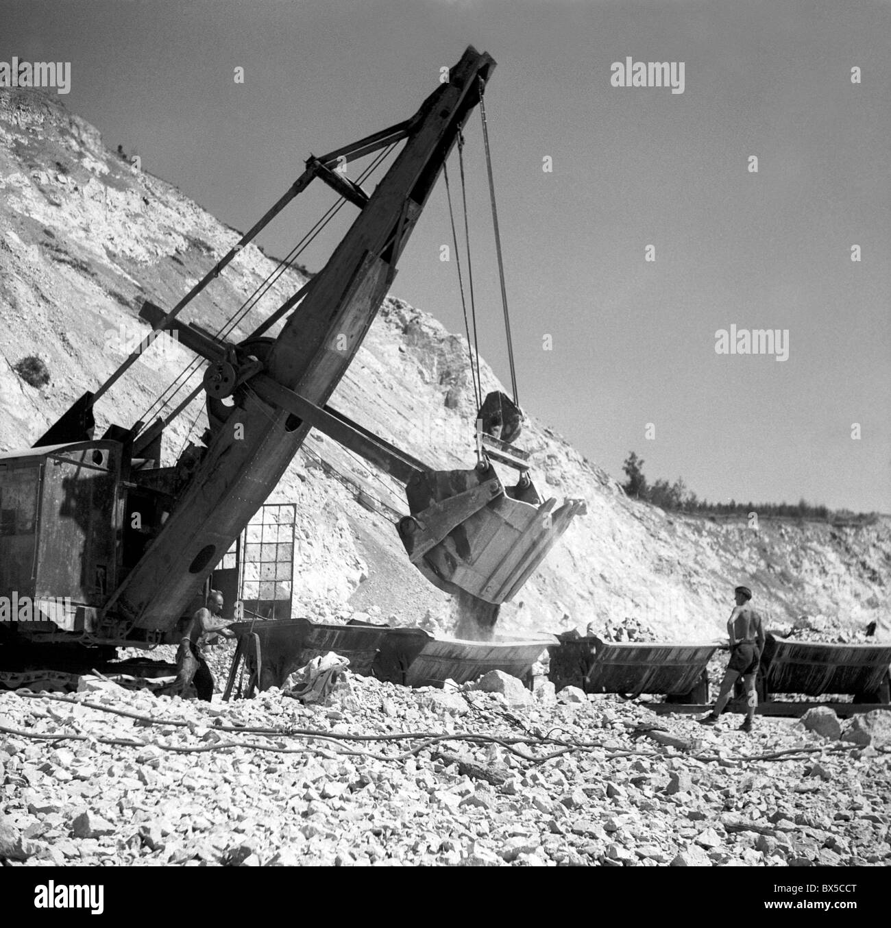 Czechoslovakia, Schtramberg 1948. Limestone mine. Loader loads ...