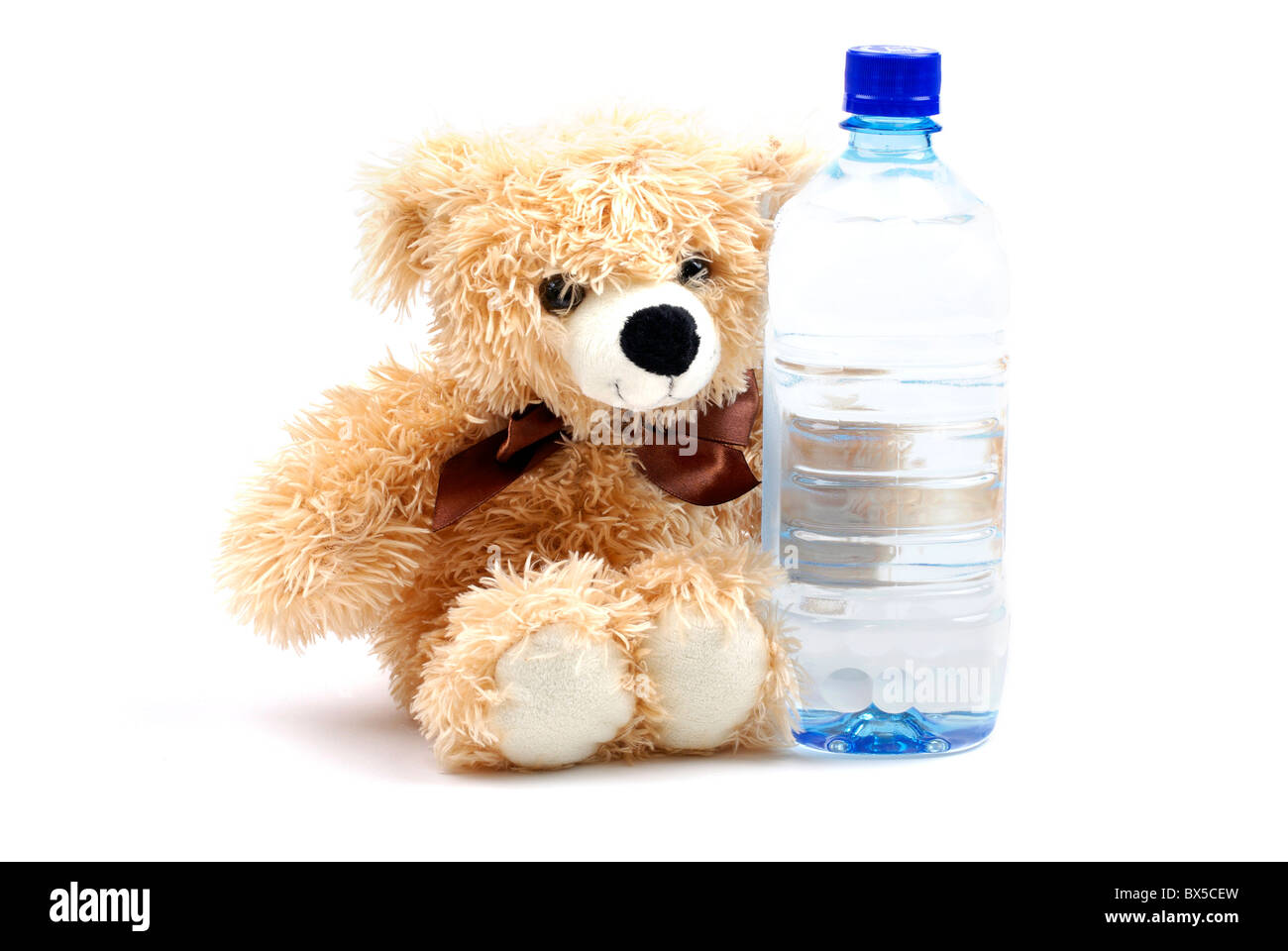 Teddy bear likes natural mineral water. Concept isolated on white ...