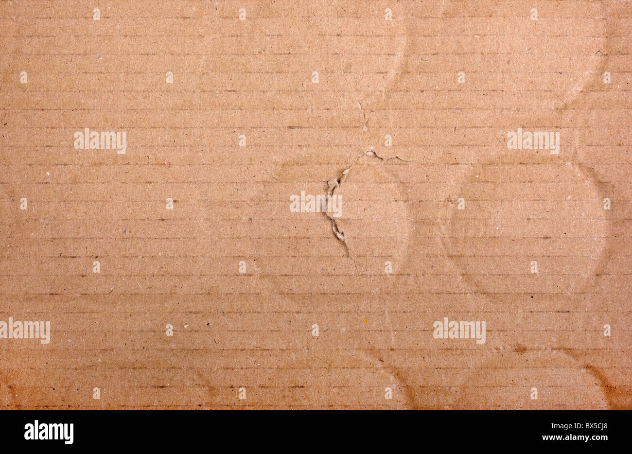 Brown damaged cardboard with bottle traces as background Stock Photo ...