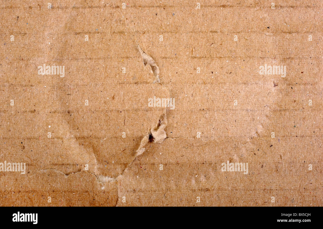 Brown damaged cardboard with bottle traces as background Stock Photo ...