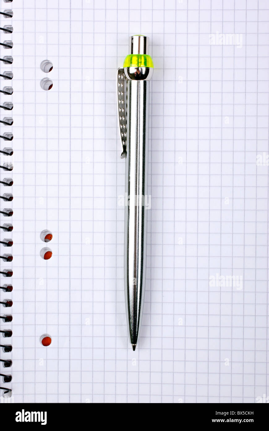 Ballpoint metallic pen laying on spiral notebook Stock Photo - Alamy