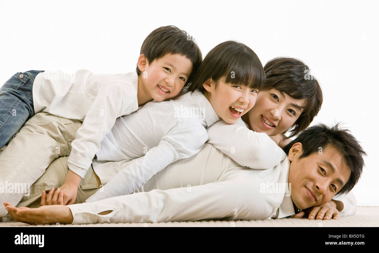 Father and mother with their two children Stock Photo - Alamy