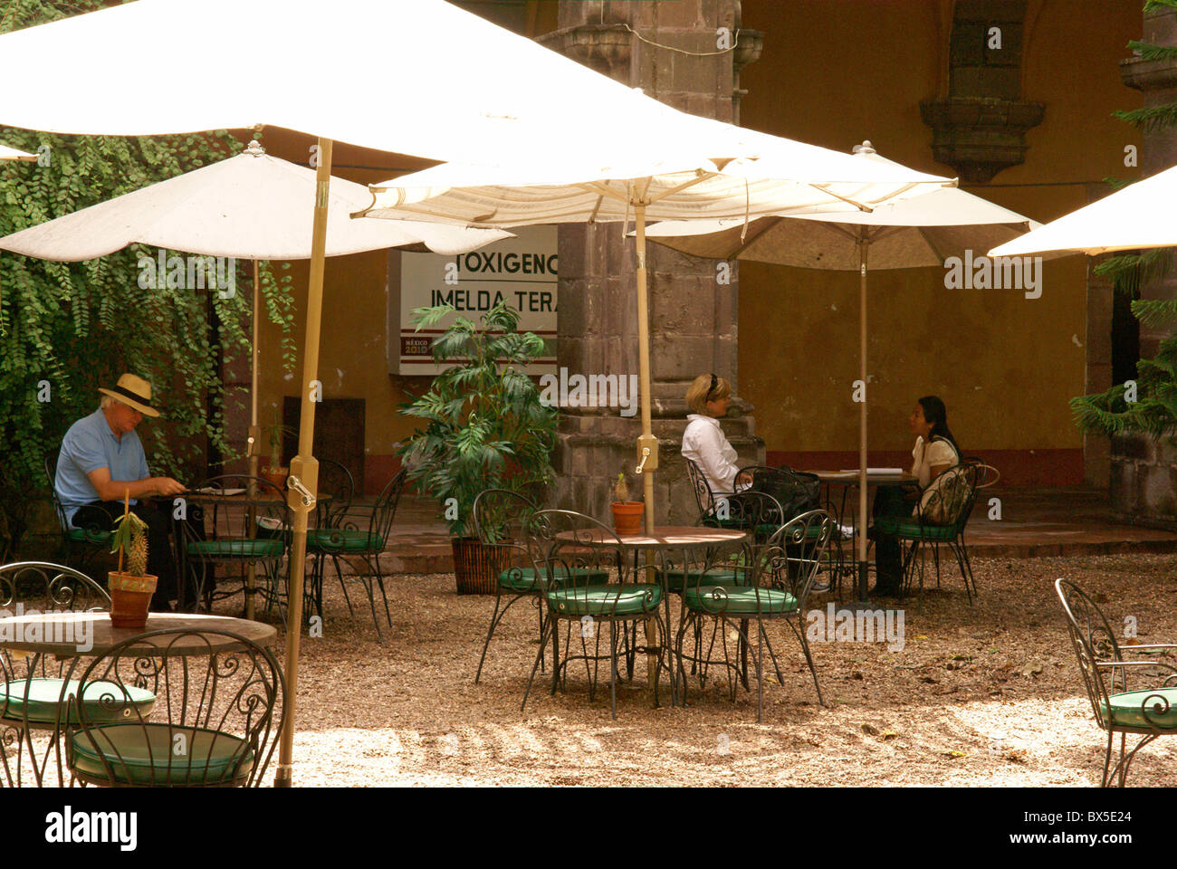 People sitting in an outdoor courtyard cafe at the Bellas Artes in San ...