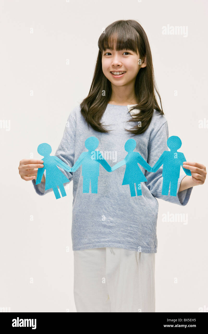 Girl holding paper chain Stock Photo - Alamy