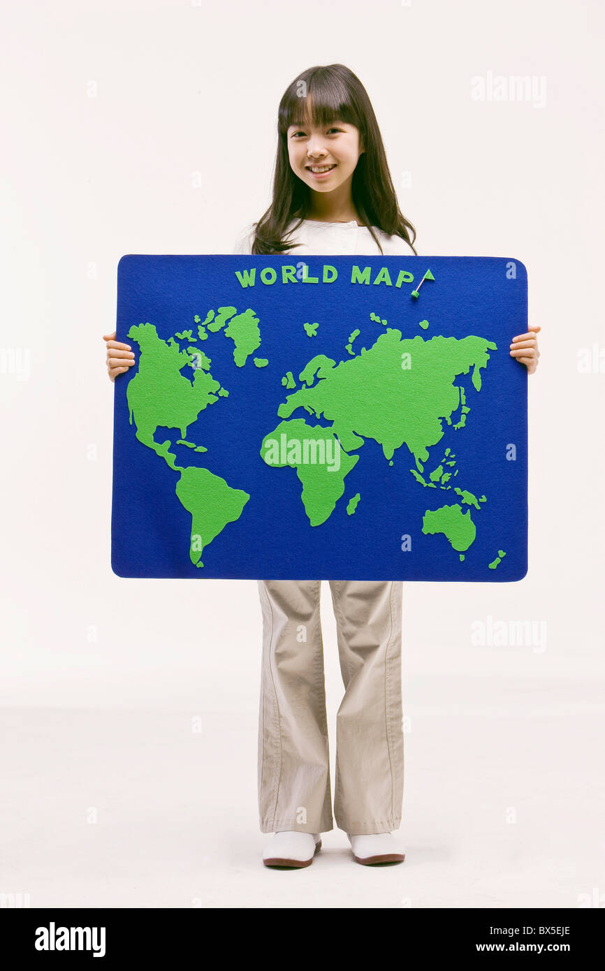 Girl holding world map,smiling Stock Photo - Alamy