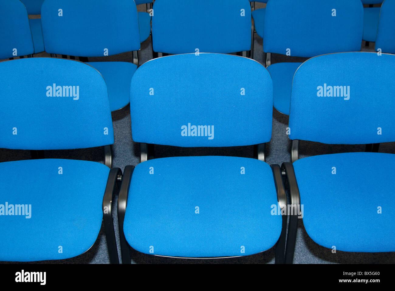 rows of blue seats in a conference centre Stock Photo - Alamy