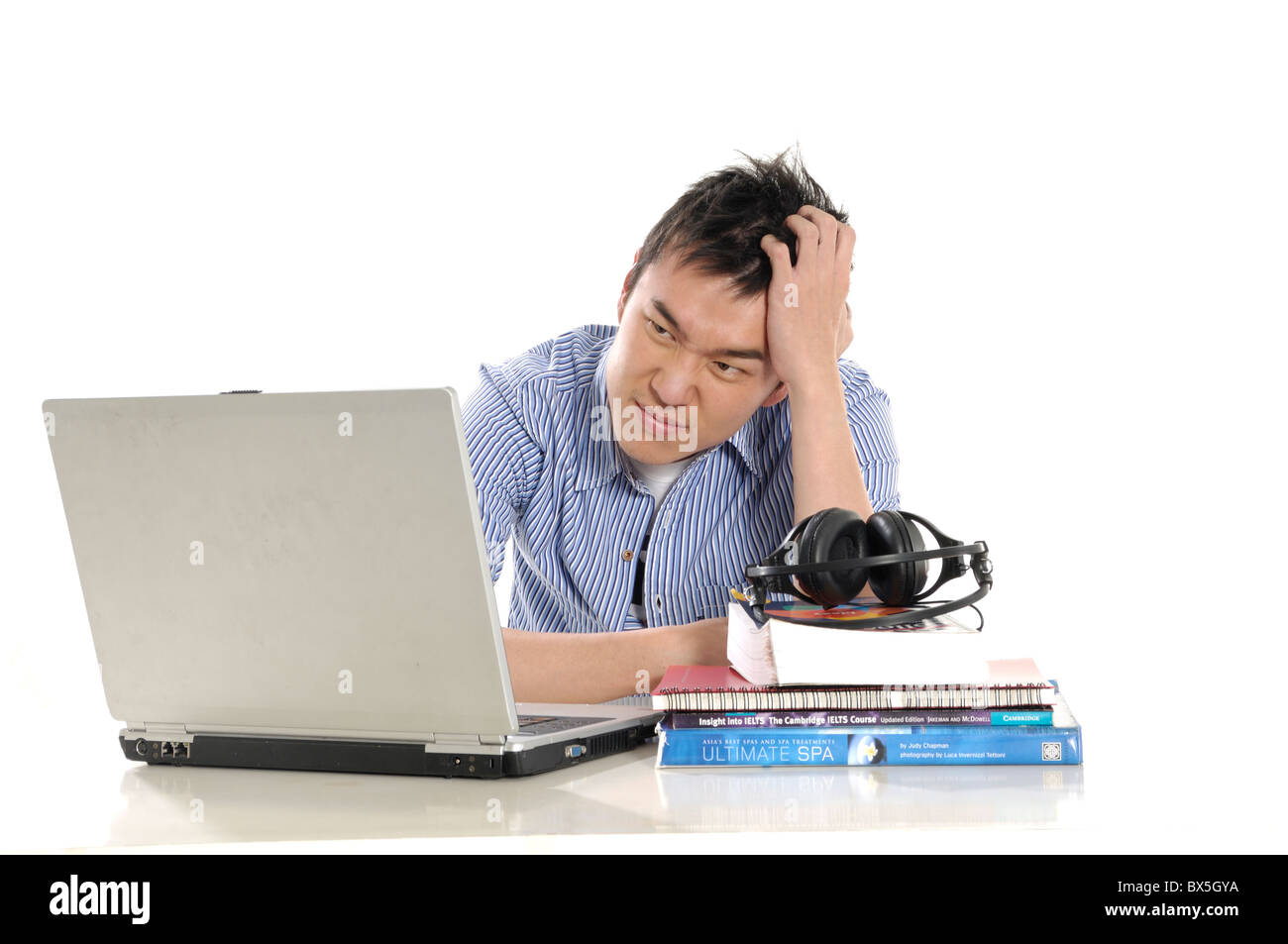 Male university student looking stressed in front of a laptop Stock ...