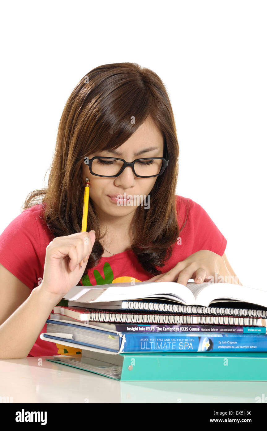 Female university student reading a book Stock Photo - Alamy