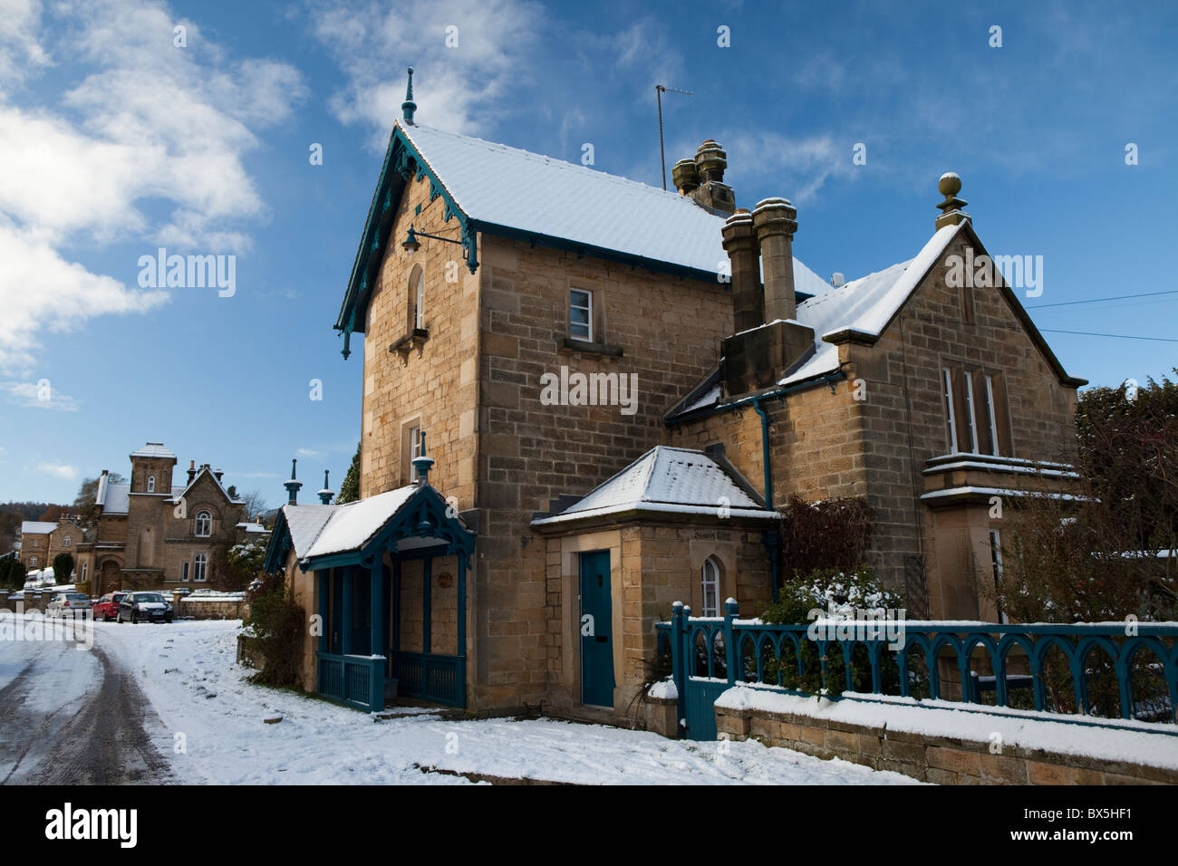 A snow covered house in Edensor village Chatsworth Derbyshire Peak ...